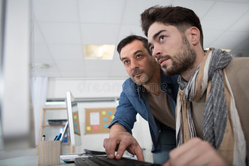 Teacher Helping Student on Computer Stock Photo - Image of teacher ...