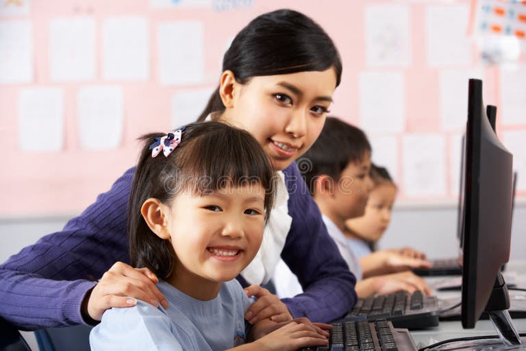 Teacher Helping Student during Computer Class Stock Image - Image of ...