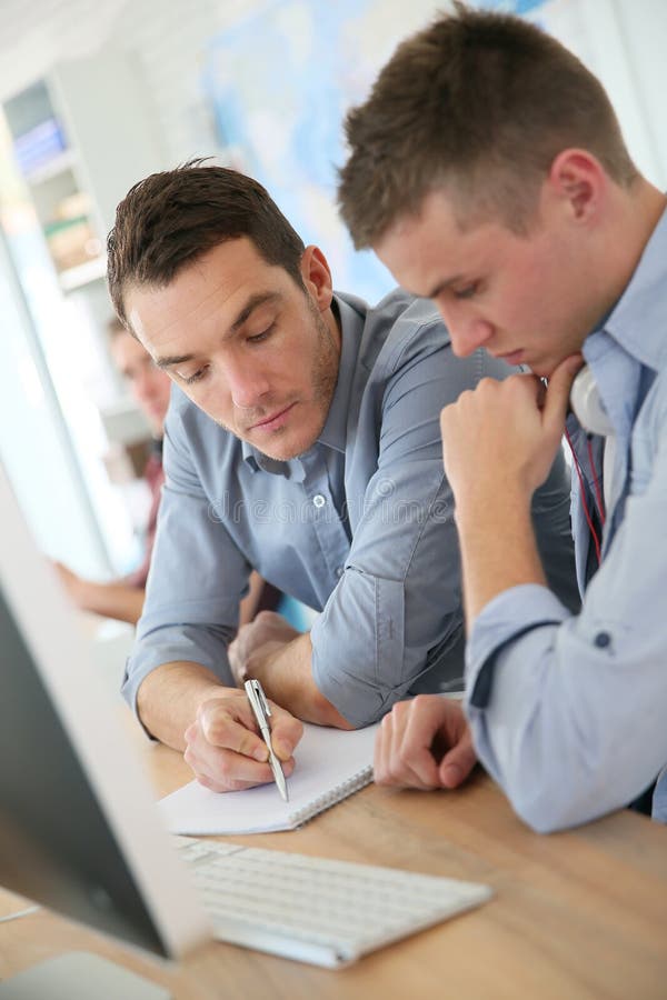 Teacher Helping Student during the Informatics Class Stock Image ...