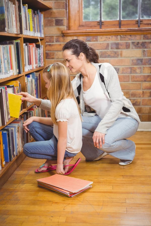 Smiling Teacher Holding Books in Her Hands Stock Image - Image of ...