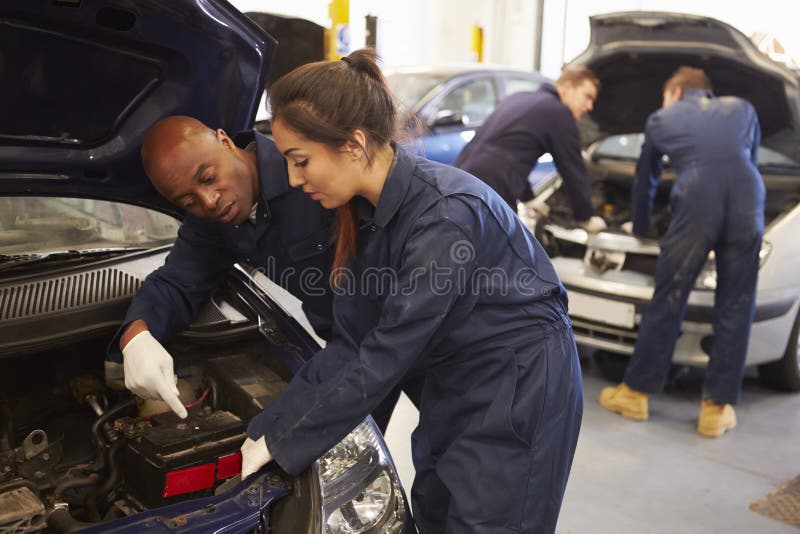 Teacher Helping Student Training To Be Car Mechanics Stock Image ...