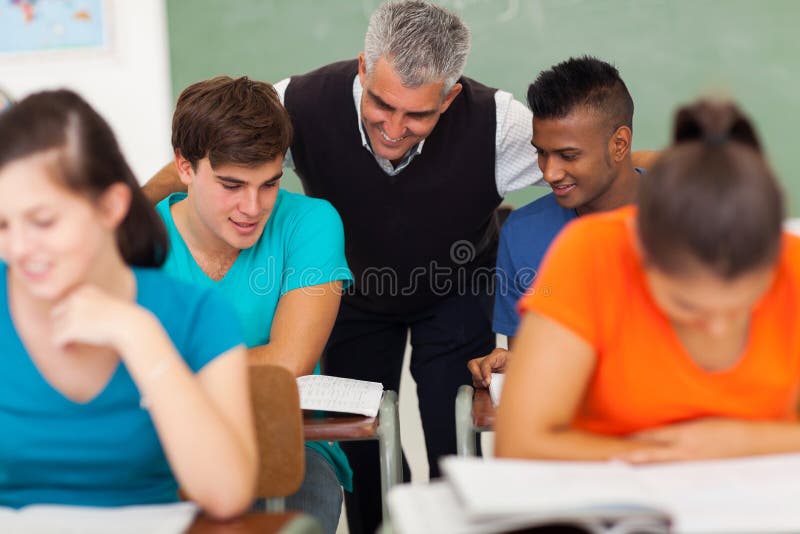 Teacher helping students stock image. Image of learners - 31577413