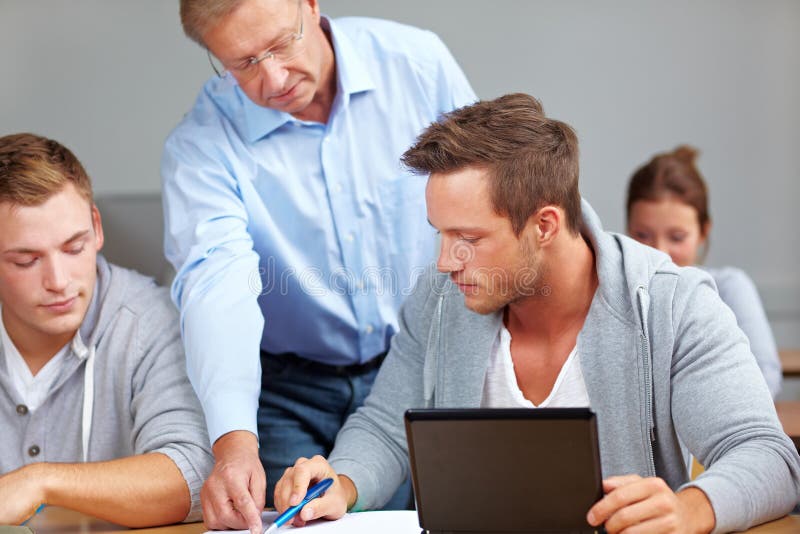 Teacher Helping Students Learning Stock Photo - Image of learn, help ...