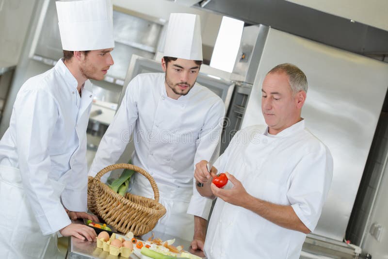 Teacher Helping Students Training To Work in Catering Stock Image ...