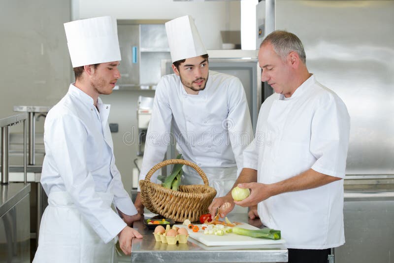 Teacher Helping Students Training To Work in Catering Stock Image ...