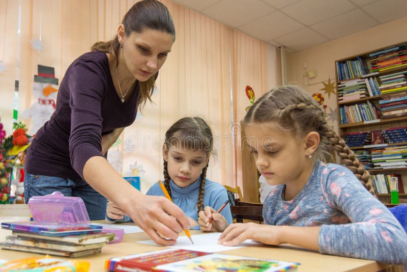 The Teacher Helps the Students in Drawing Class Stock Image - Image of ...
