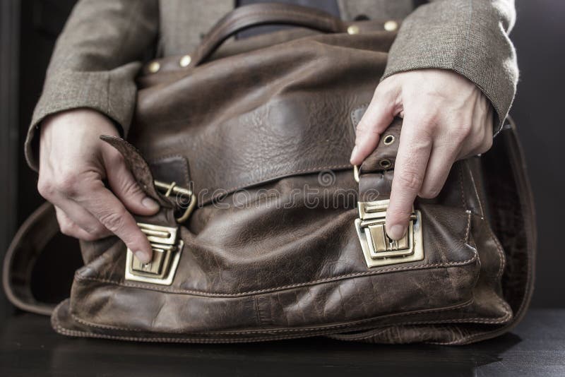 Teacher in a Jacket Gets a Book from an Old Leather Briefcase Stock ...
