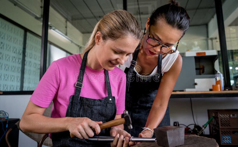 Teacher Jeweler and Student Make Jewelry in Workshop Stock Image ...