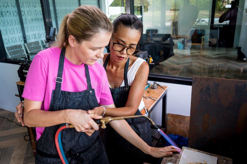 Teacher Jeweler and Student Using Burner in Workshop Stock Image ...