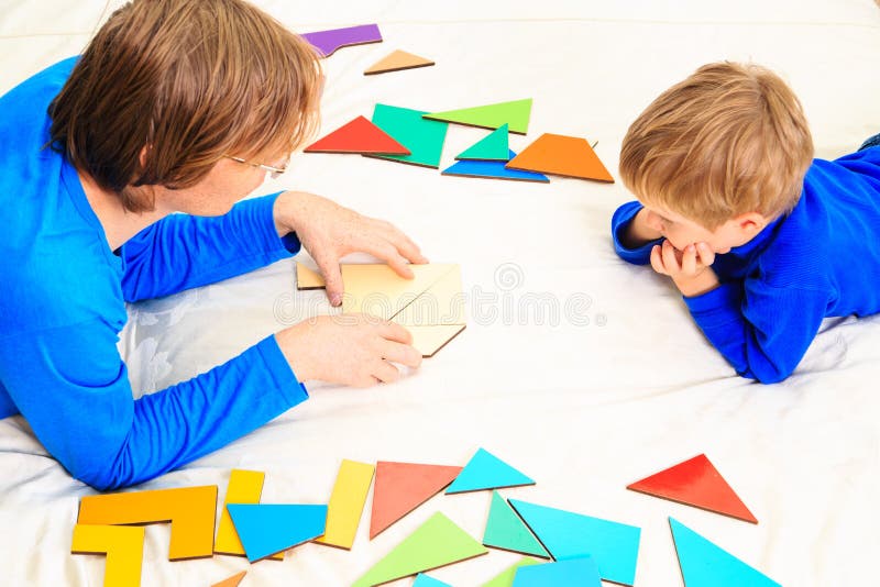 Teacher and Kid Playing with Geometric Shapes Stock Image - Image of ...