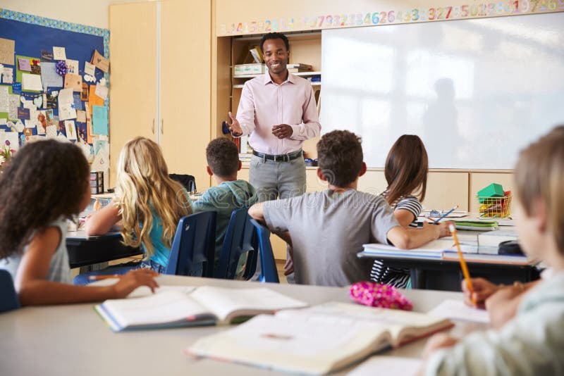 Teacher and Kids during a Lesson at an Elementary School Stock Image ...