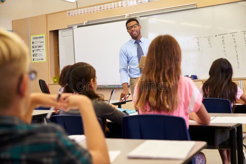 Teacher and Kids during a Lesson at an Elementary School Stock Photo ...