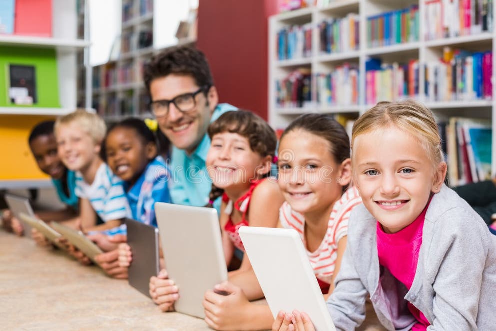 Teacher and Kids Using Digital Tablet in Library Stock Image - Image of ...