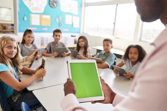 Teacher and Kids Using Tablets in Elementary School Lesson Stock Image ...