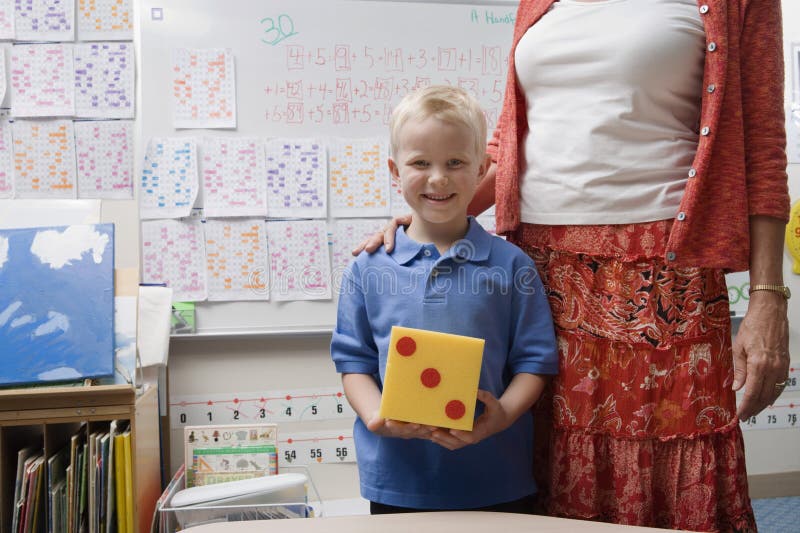 Teacher with Little Boy Holding Large Dice Stock Image - Image of cute ...