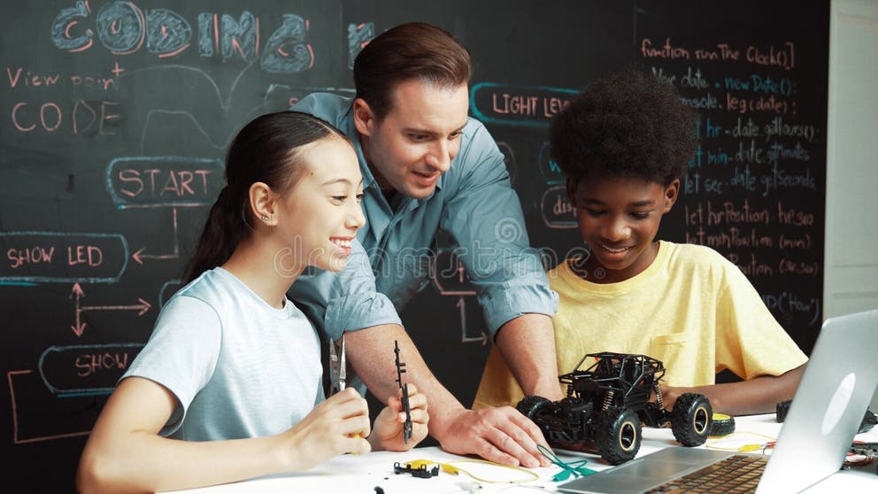 Teacher Looking at Laptop Screen while Explain Car Model System. Edification. Stock Photo ...