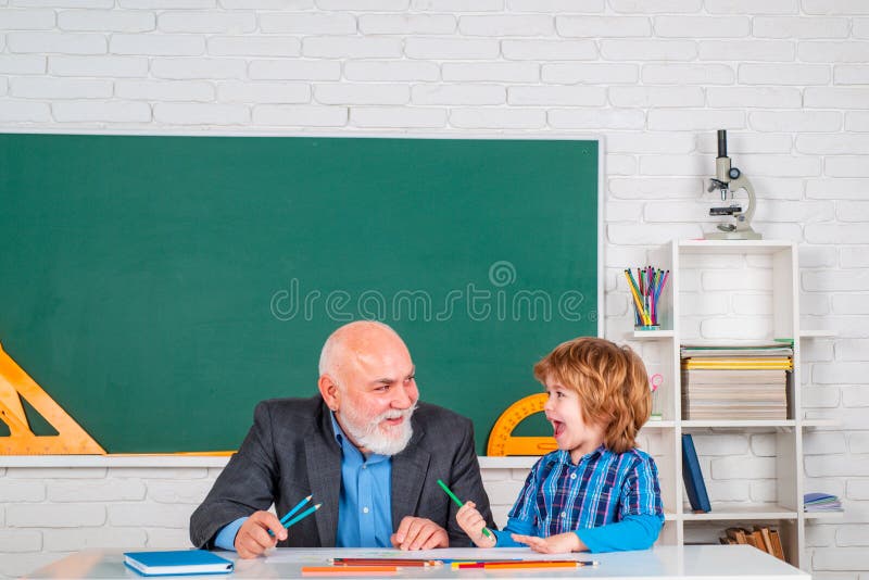 Teacher with Male Elementary School Pupil with Problem. Science ...