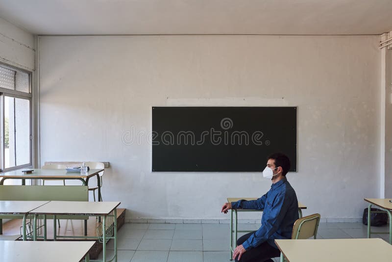Teacher with Mask in a Class Stock Image - Image of confinement, chair ...