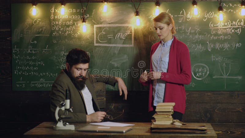 Teacher in Math School Explanation Math Lesson. Professor in a ...