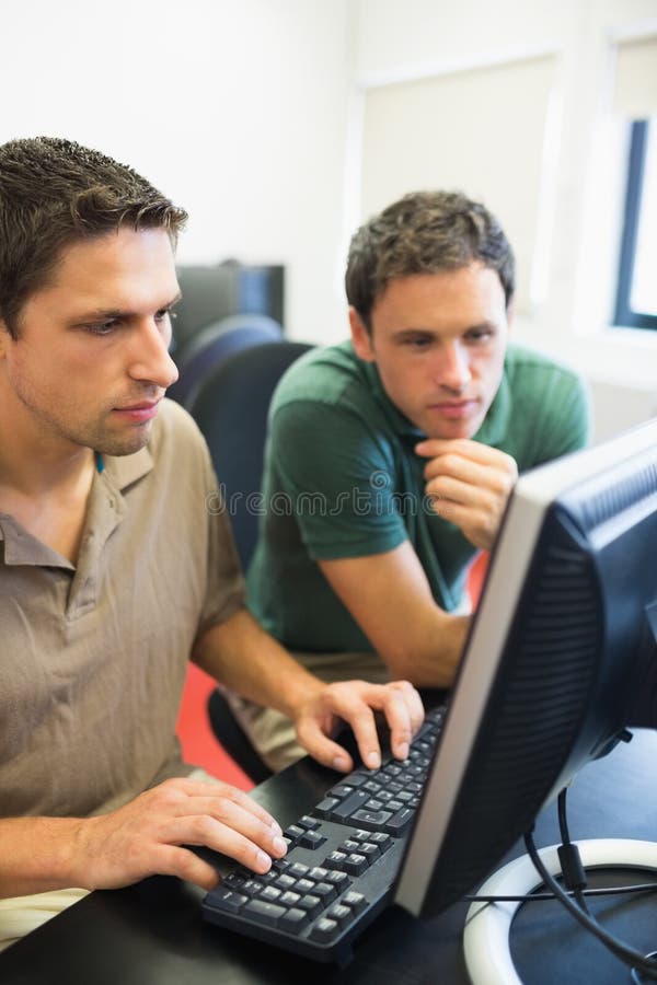 Teacher and Mature Student in Computer Room Stock Photo - Image of ...