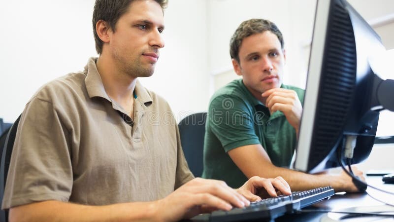 Teacher and Mature Student in Computer Room Stock Photo - Image of ...