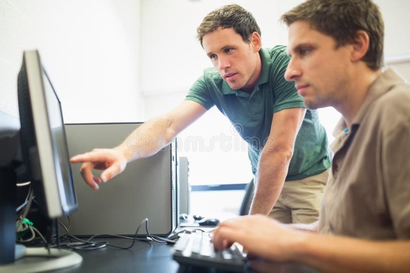 Teacher and Mature Student in Computer Room Stock Photo - Image of ...