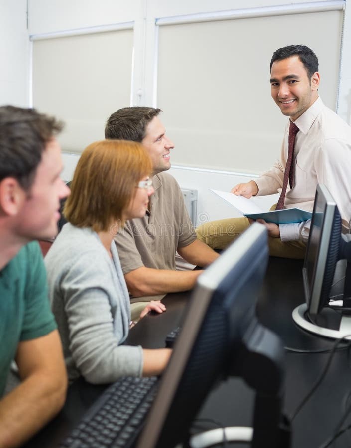 Teacher and Mature Students in Computer Room Stock Image - Image of ...