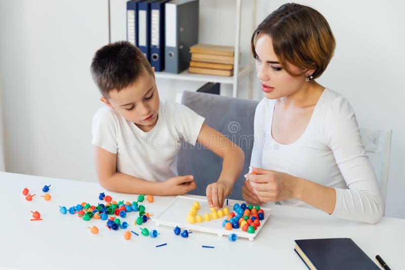 Teacher Playing Educational Games with Boy at School Stock Image ... Teacher Playing Educational Games with Boy at School Stock Image ...