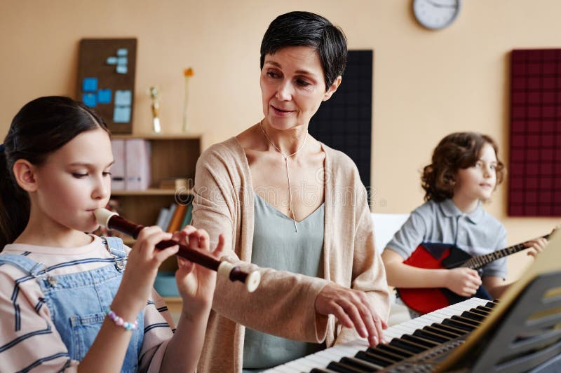 Teacher Playing Musical Instruments with Student Stock Photo - Image of ...