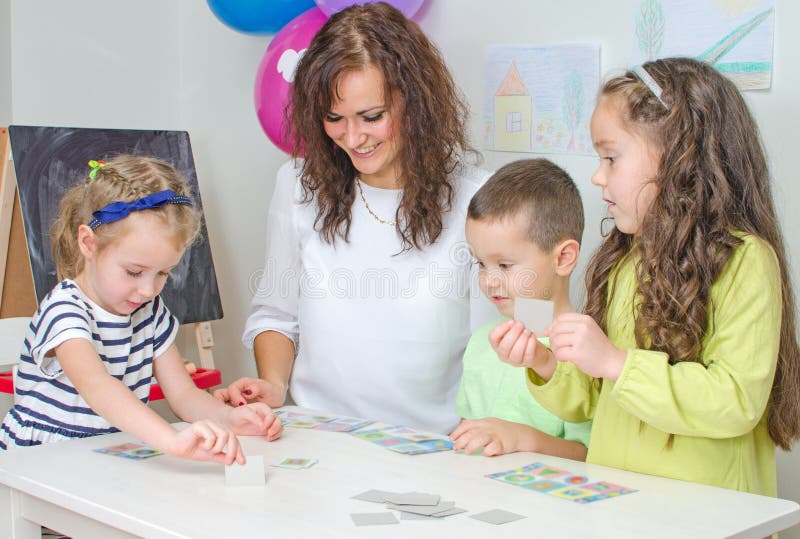 Teacher Plays with Children Stock Photo - Image of nursery, caucasian ...