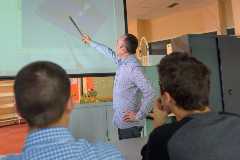 Teacher Pointing To Image on Projected Screen Stock Image - Image of ... Teacher Pointing To Image on Projected Screen Stock Image - Image of ...