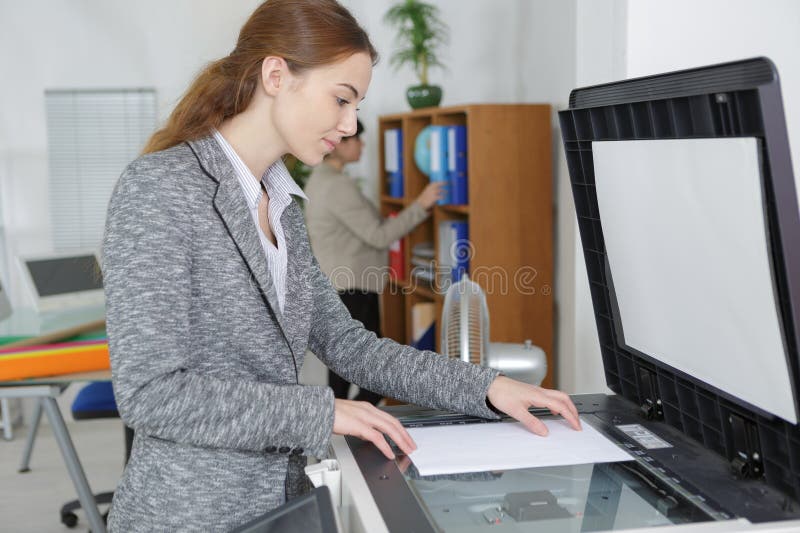 Teacher Printing Off Work Sheets for Next Lesson Stock Image - Image of ...