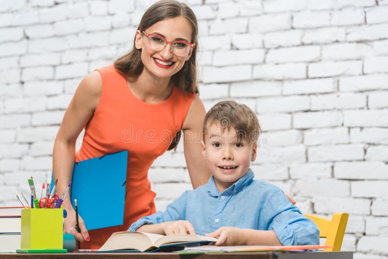 Teacher and Pupil Doing Task Together Stock Image - Image of student ...