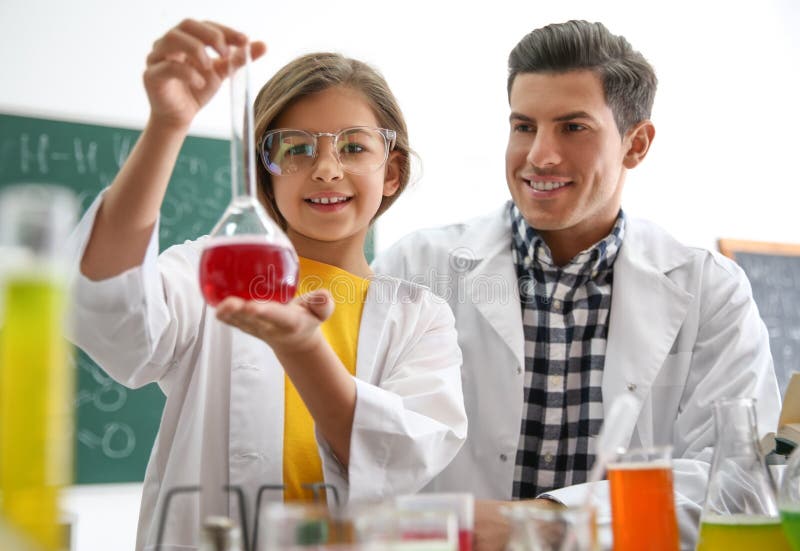 Teacher with Pupil Making Experiment in Class Stock Photo - Image of ...