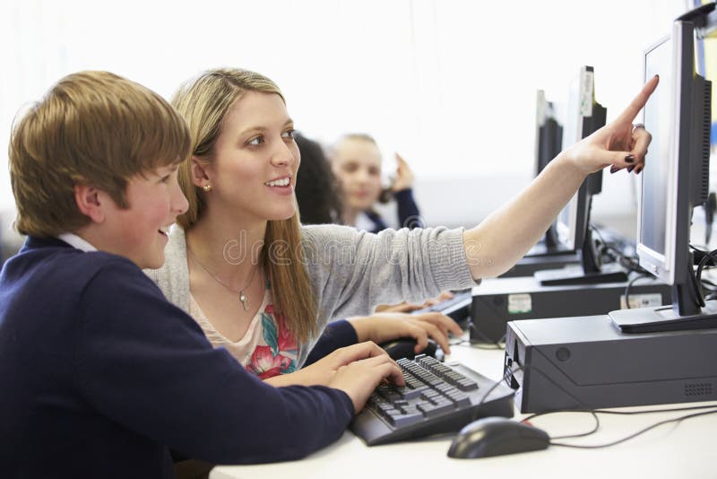 Teacher and Pupil in School Computer Class Stock Photo - Image of ...