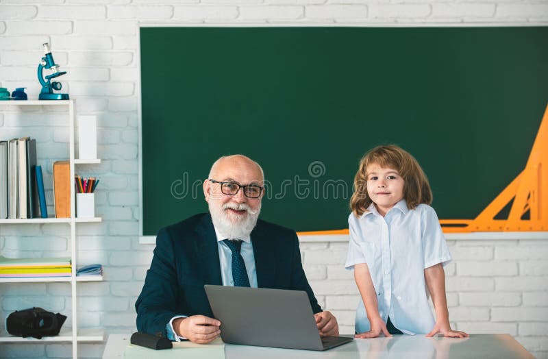 Teacher and Pupil in School. Kids Learning Concept. Boy Elementary ...