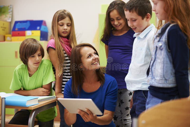 Teacher with pupils stock image. Image of education, kids - 56438135
