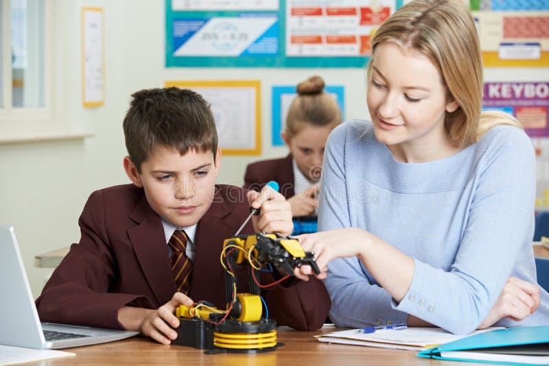 Teacher with Pupils in Science Lesson Studying Robotics Stock Photo ...
