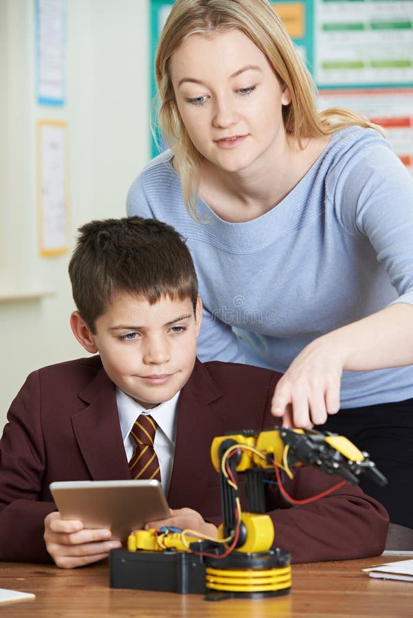 Teacher with Pupils in Science Lesson Studying Robotics Stock Photo ...