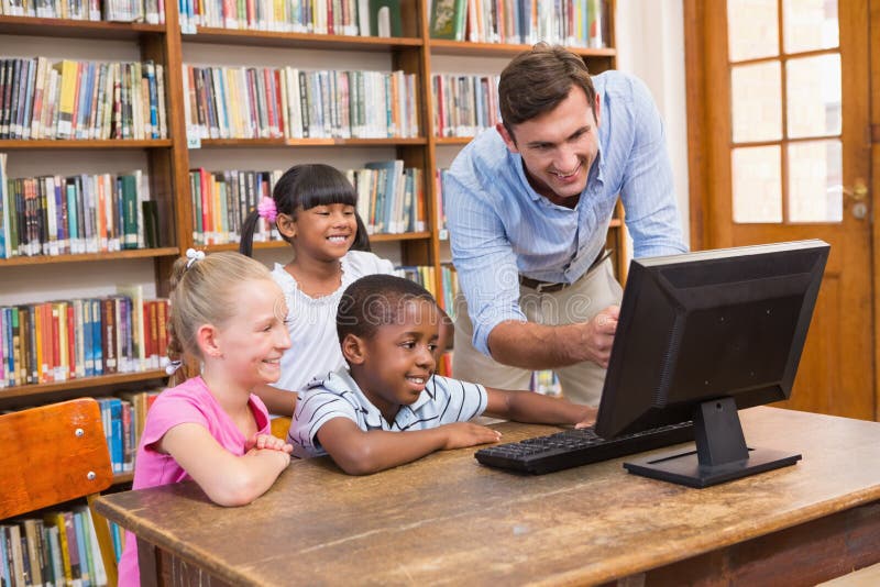 Teacher and Pupils Using Computer at Library Stock Photo - Image of ...