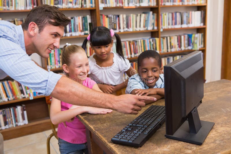 Teacher and Pupils Using Computer at Library Stock Photo - Image of ...