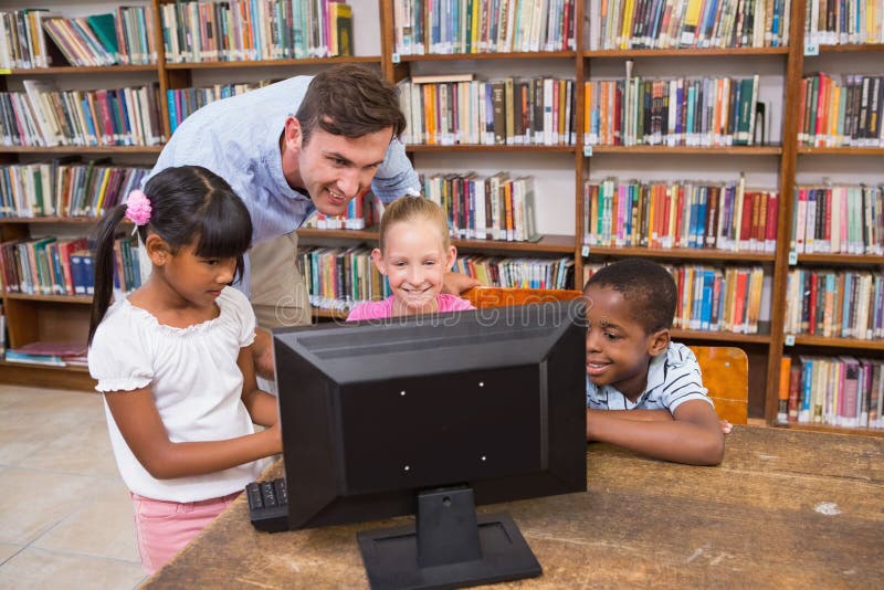 Teacher and Pupils Using Computer at Library Stock Image - Image of ...