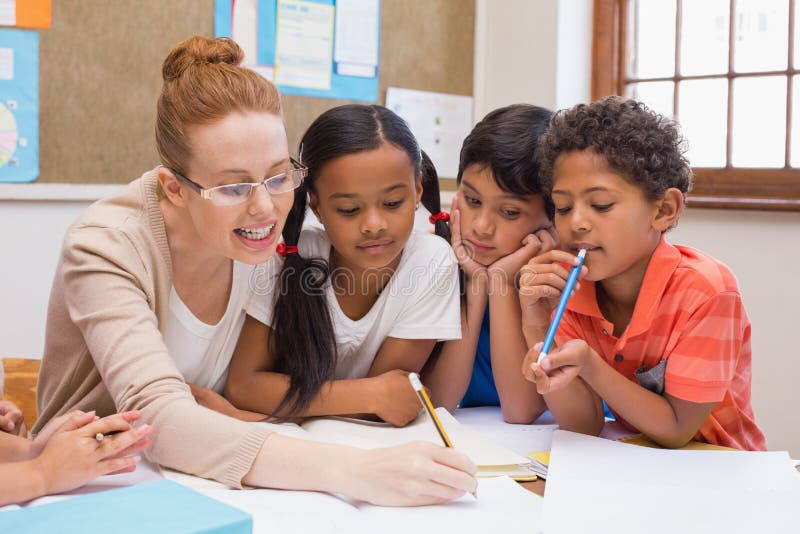 Pupils working together stock photo. Image of notebook - 22692292 Pupils working together stock photo. Image of notebook - 22692292