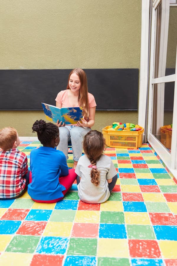 Teacher Reading from Children`s Book Stock Photo - Image of nursery ...