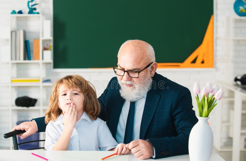 Teacher and School Boy Doing Homework Assignment at School. Stock Image ...