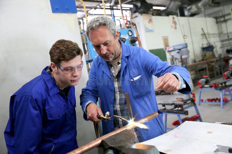 Teacher Showing Apprentice Metallurgical Technics Stock Photo - Image ...