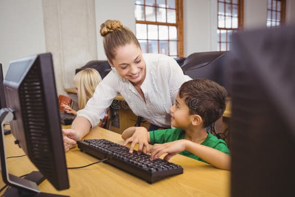 Teacher Showing Student How To Use a Computer Stock Image - Image of ...