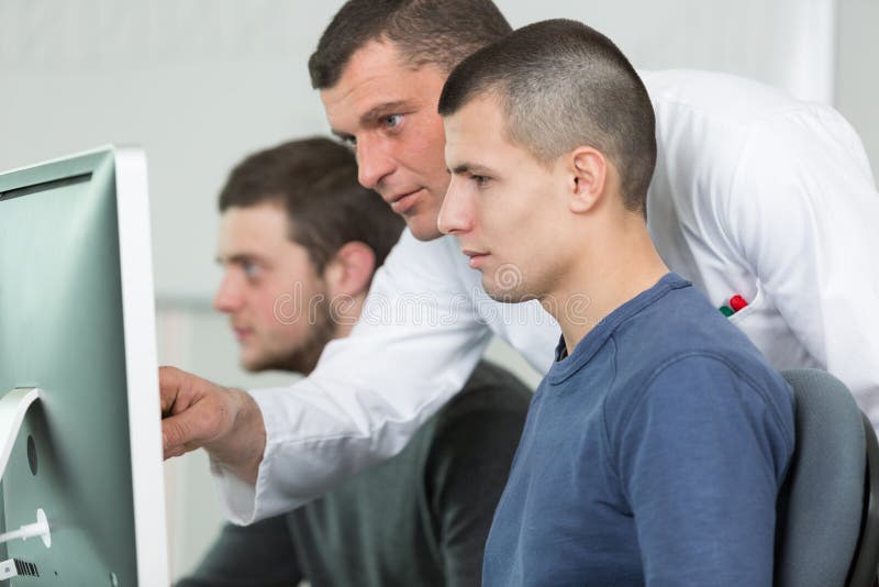 Teacher Showing Student Information on Computer Screen Stock Image ...
