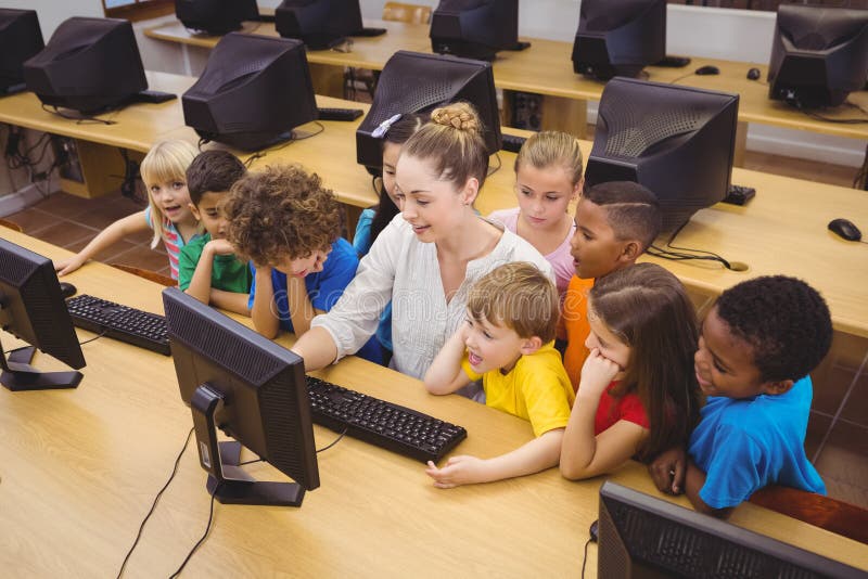 Teacher Showing Students How To Use a Computer Stock Photo - Image of ...