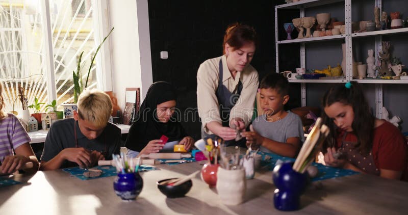 Teacher Shows Student Technique of Modeling Clay Element Stock Video ...